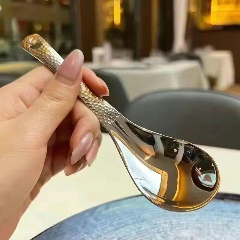 Retro-style hammered spoon.Made of stainless steel.Hammered pattern ...