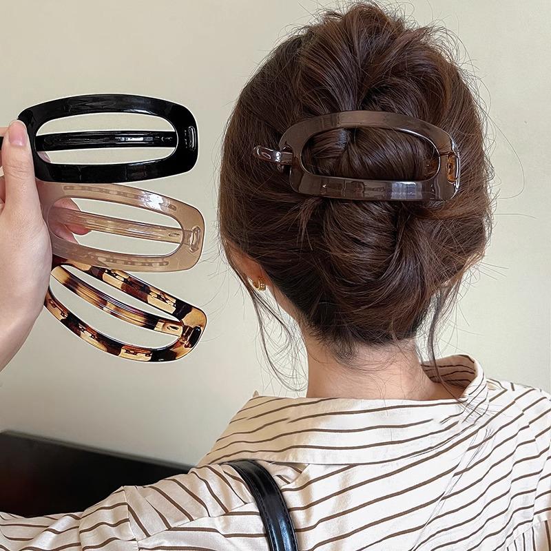 Elliptical hair clip for women, with a back of the head and multiple ...