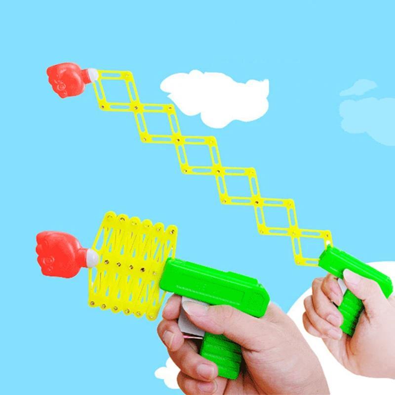 Retractable Fist Shooter Trick Toy Funny Child Kids plastic Party ...